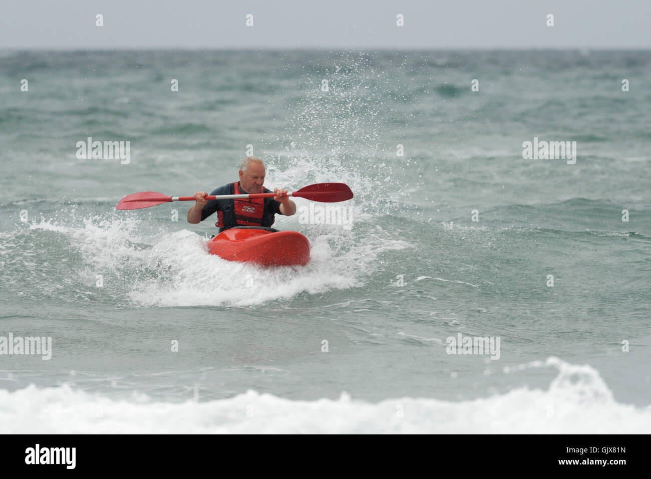 Kayaking on the beach in the surf at Porth Neigwl Stock Photo - Alamy
