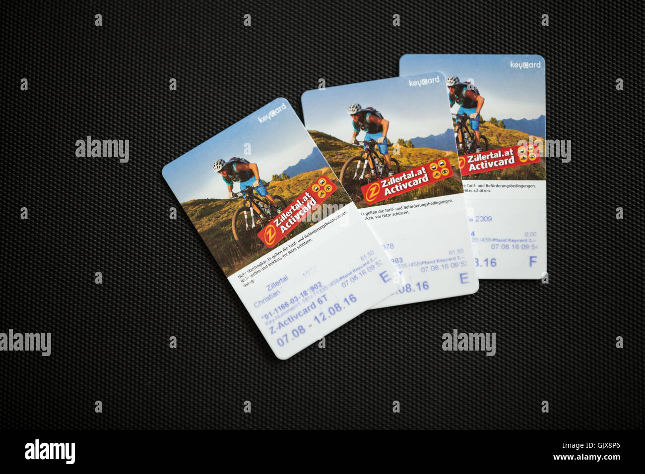 Three Zillertal Activcard summer 2016 on black background Stock Photo ...