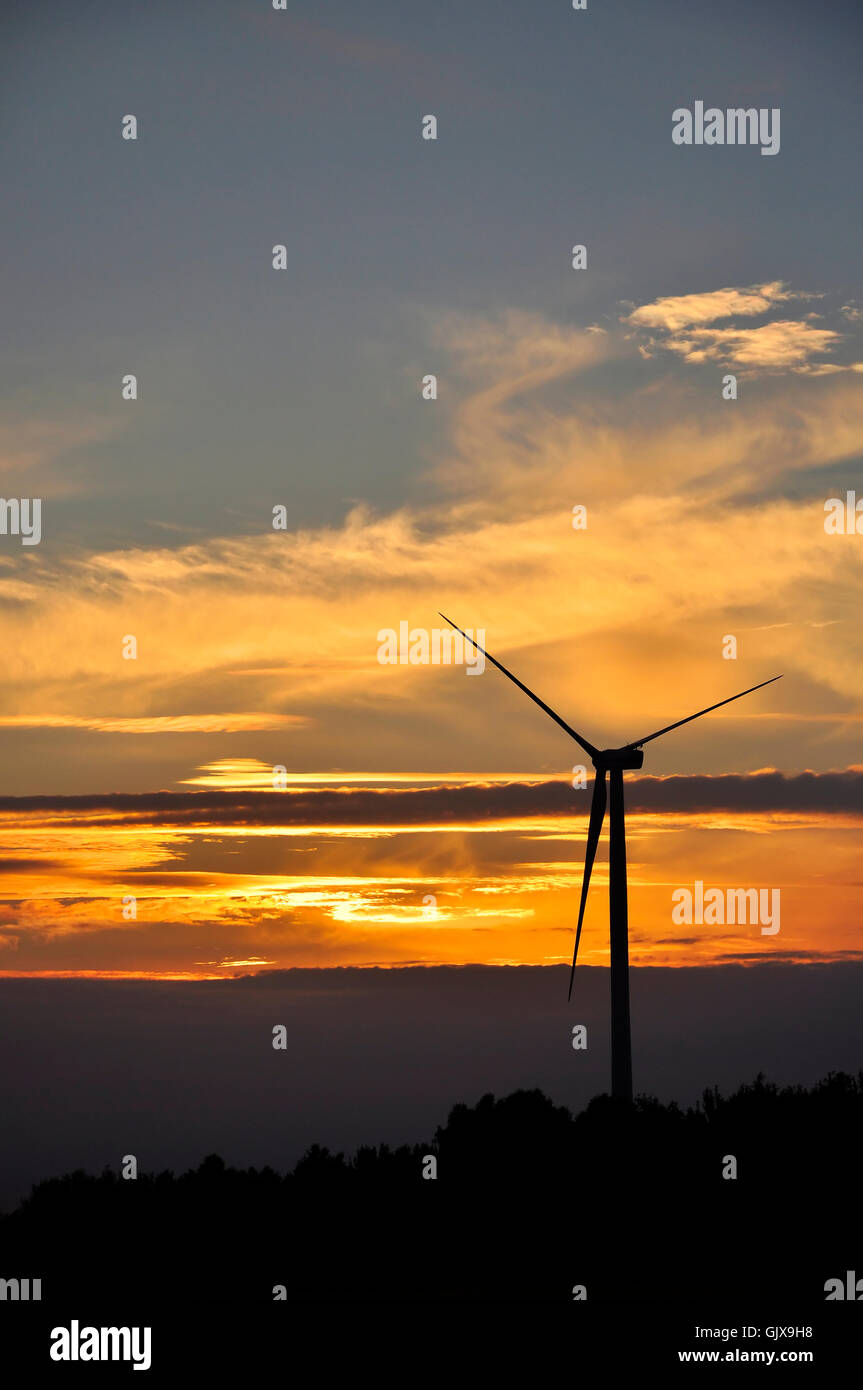 Wind turbine farm over sunset Stock Photo - Alamy