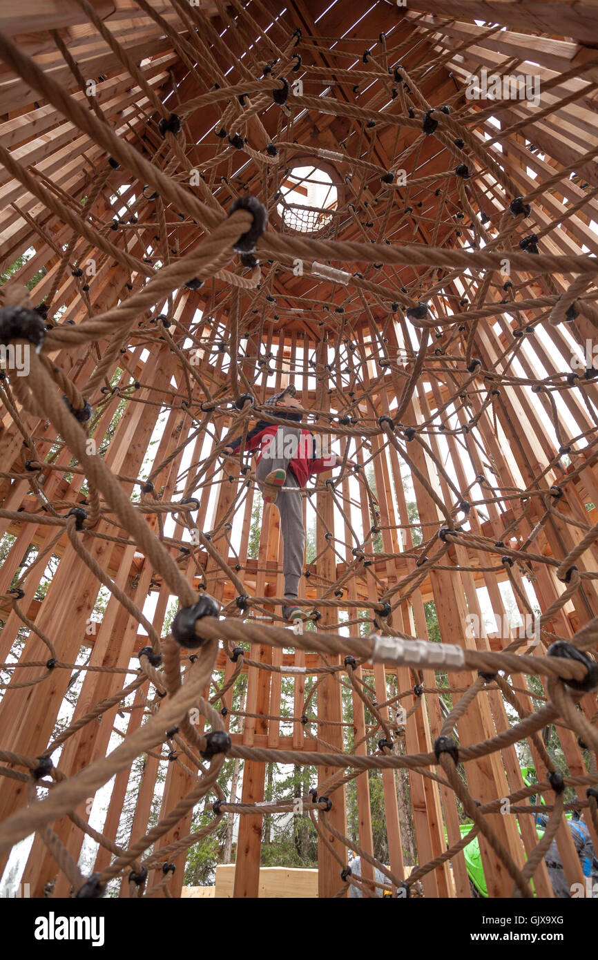 Boy climbing rope tower in Spruce Tree Castle at Rosenalm park near ...