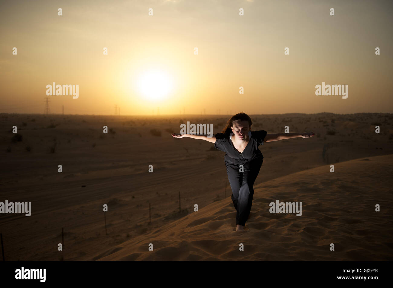 Woman in the desert Stock Photo - Alamy