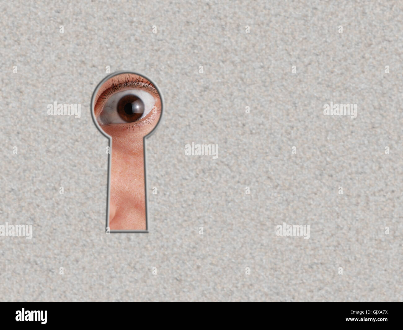 Look through a keyhole in stone wall Stock Photo - Alamy
