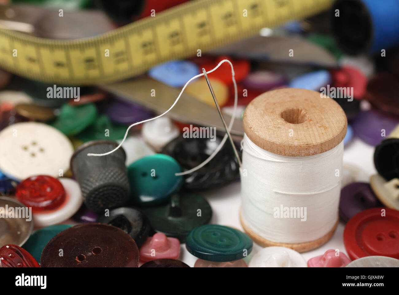 Needle and a thread Stock Photo - Alamy