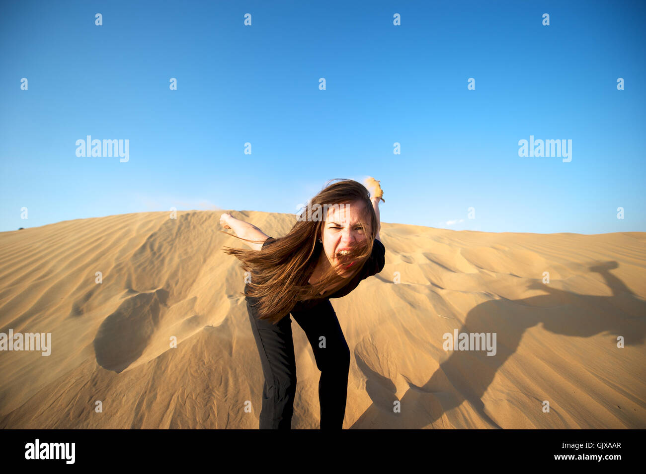 Woman in the desert Stock Photo - Alamy