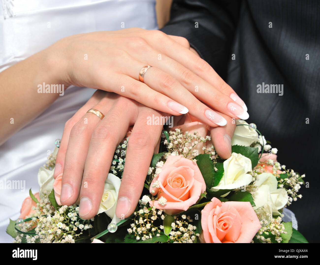 Hands of a newly-married couple Stock Photo - Alamy