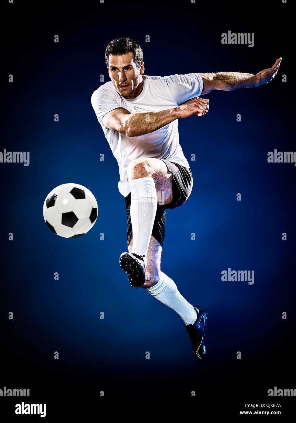 one caucasian soccer player man isolated on black background Stock ...