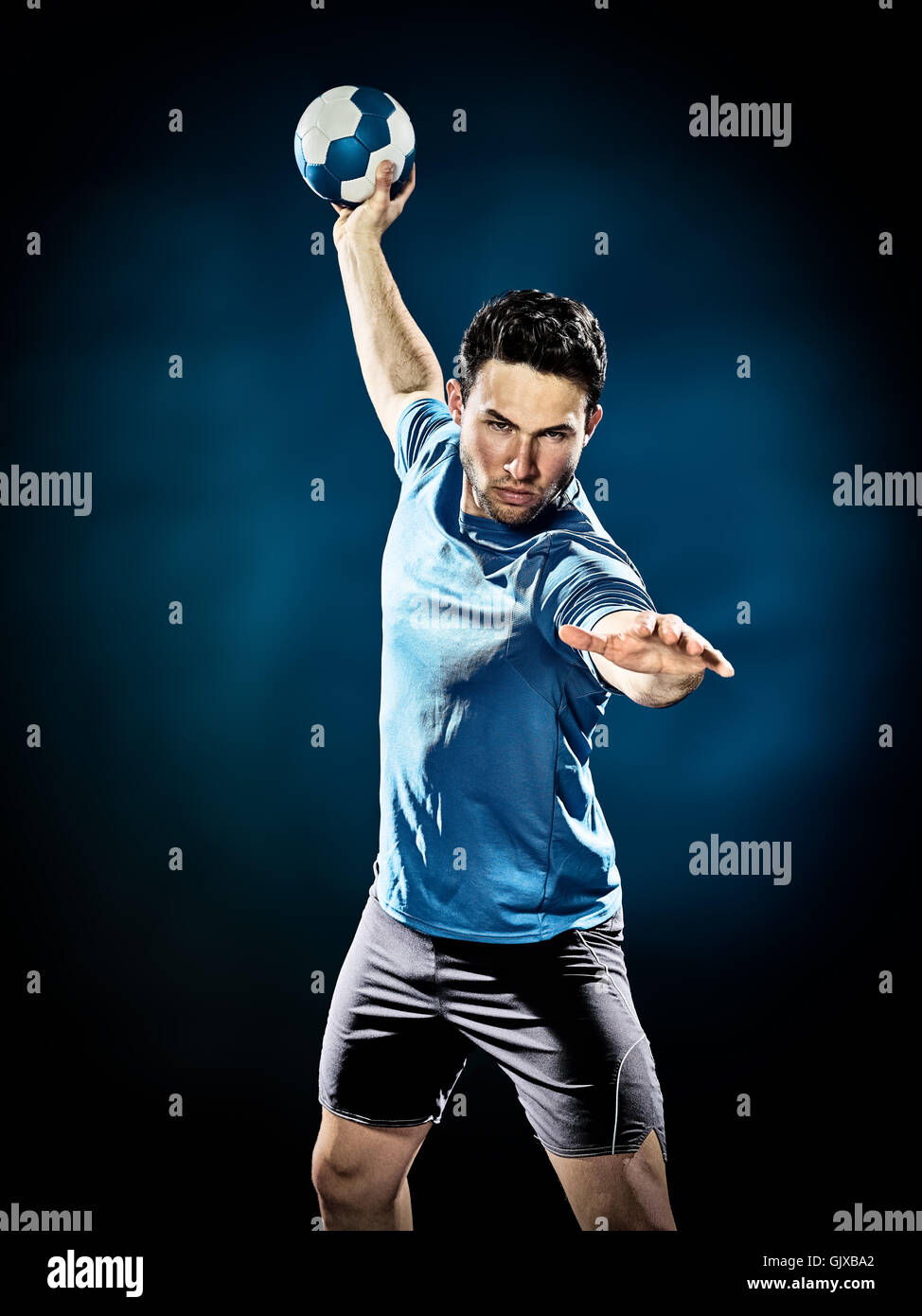one caucasian man handball player isolated on black background Stock ...