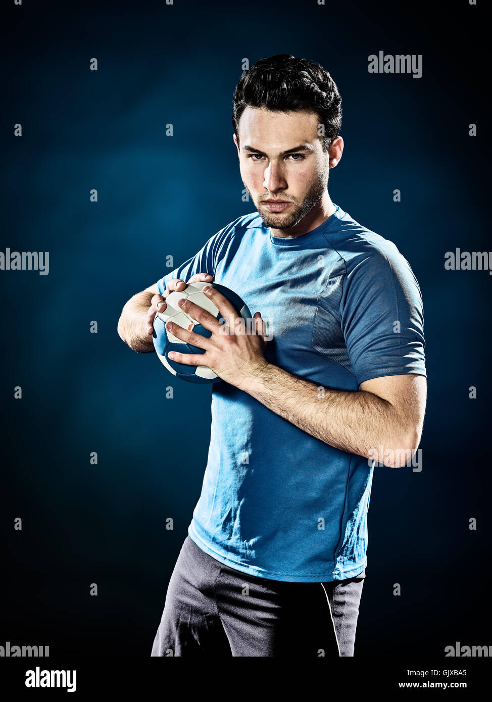 one caucasian man handball player isolated on black background Stock ...