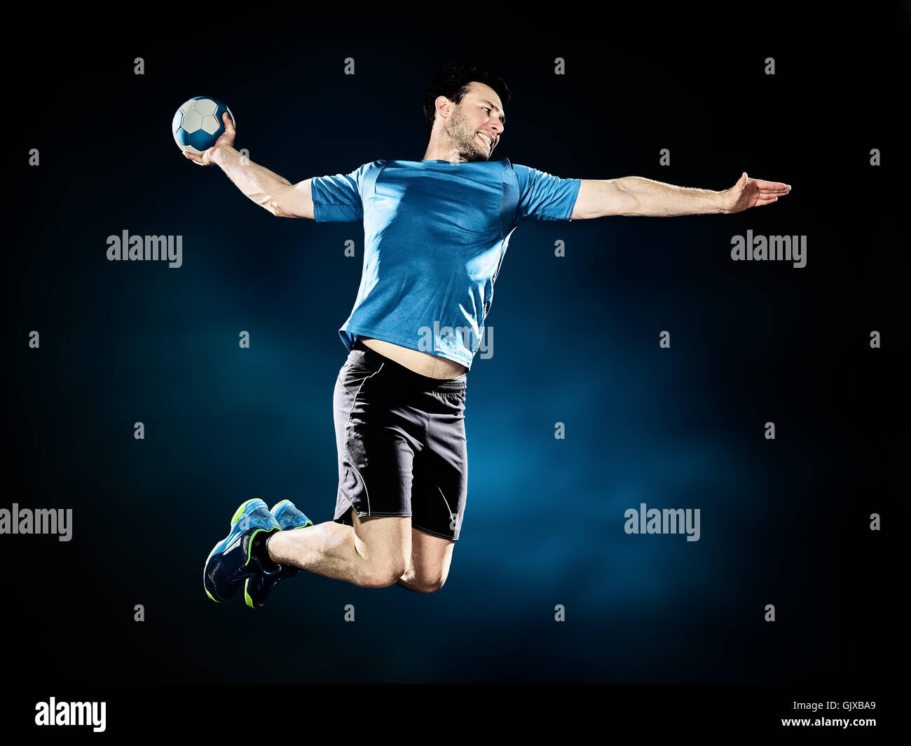 one caucasian man handball player isolated on black background Stock ...