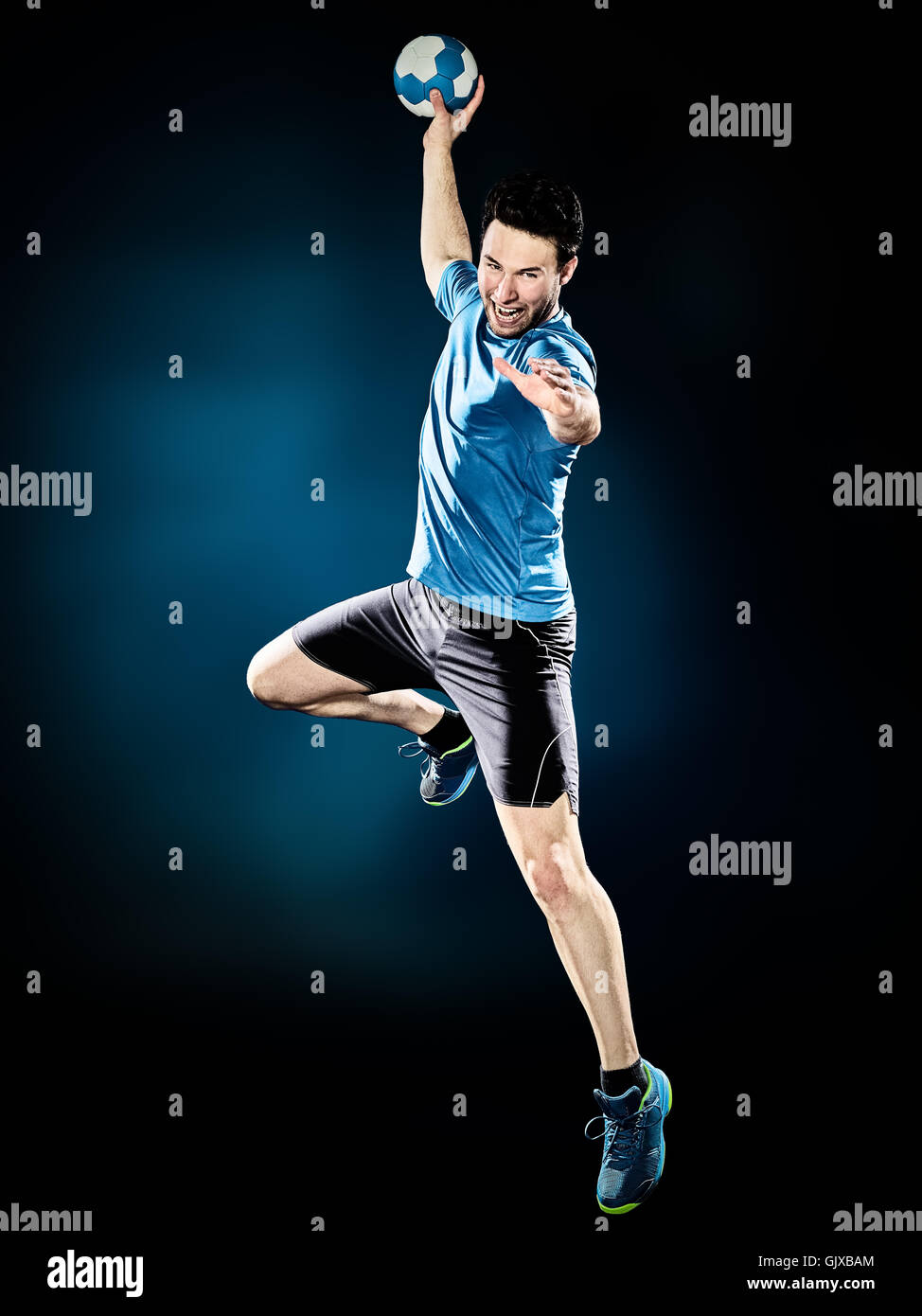 one caucasian man handball player isolated on black background Stock ...