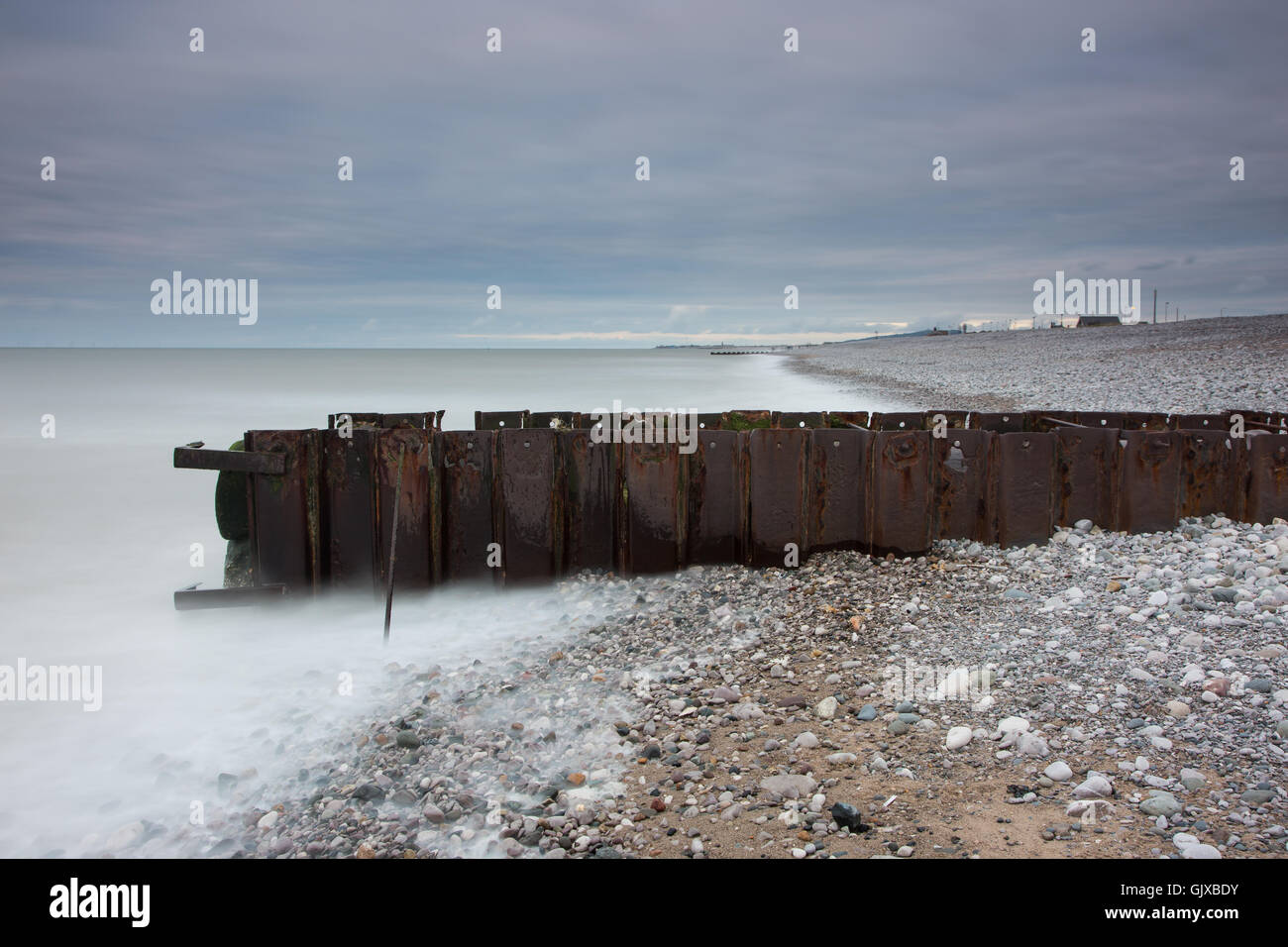 Pensarn beach in North Wales with the remains f the old sewage outflows ...