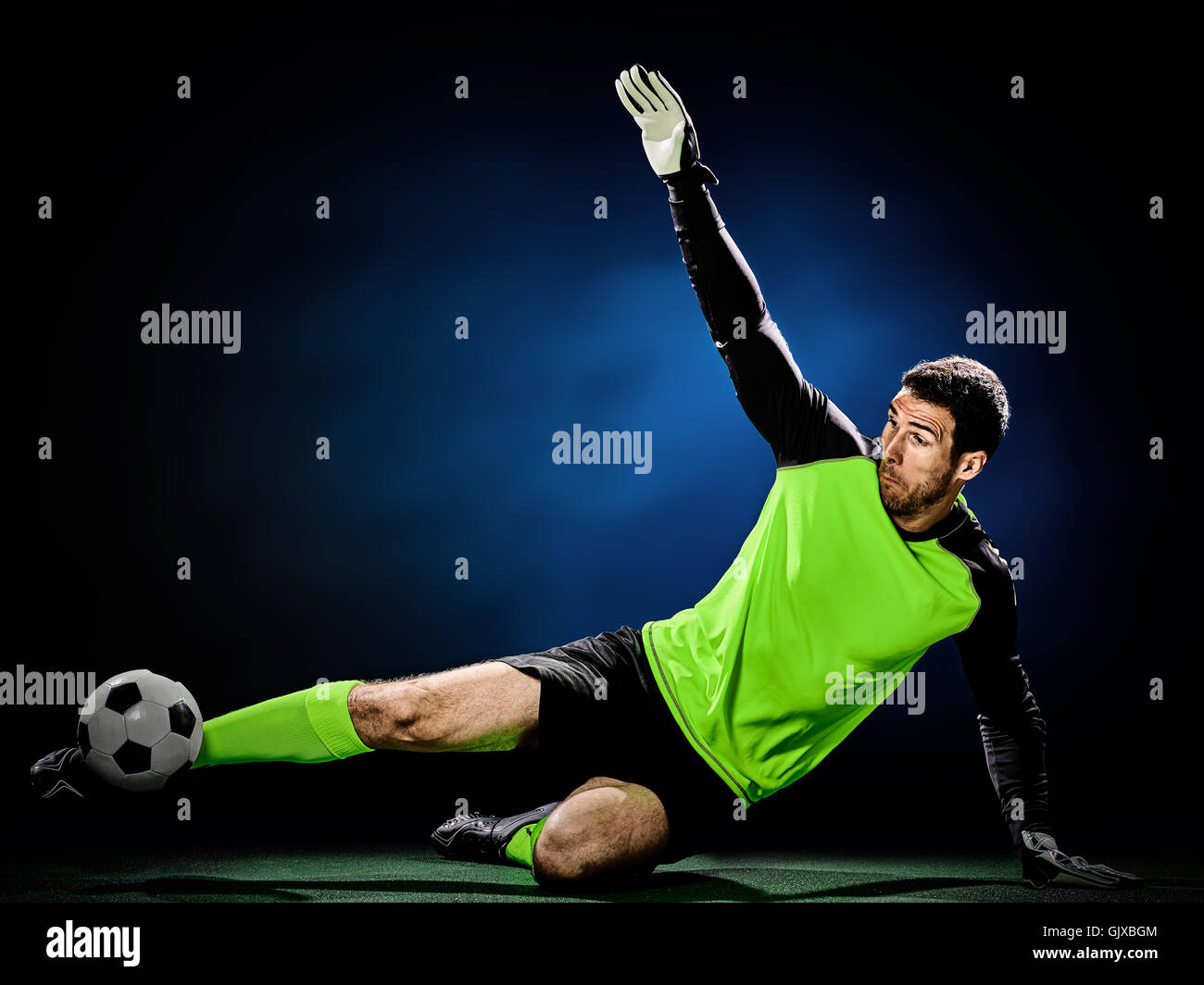 one caucasian goalkeeper soccer man isolated on black background Stock ...