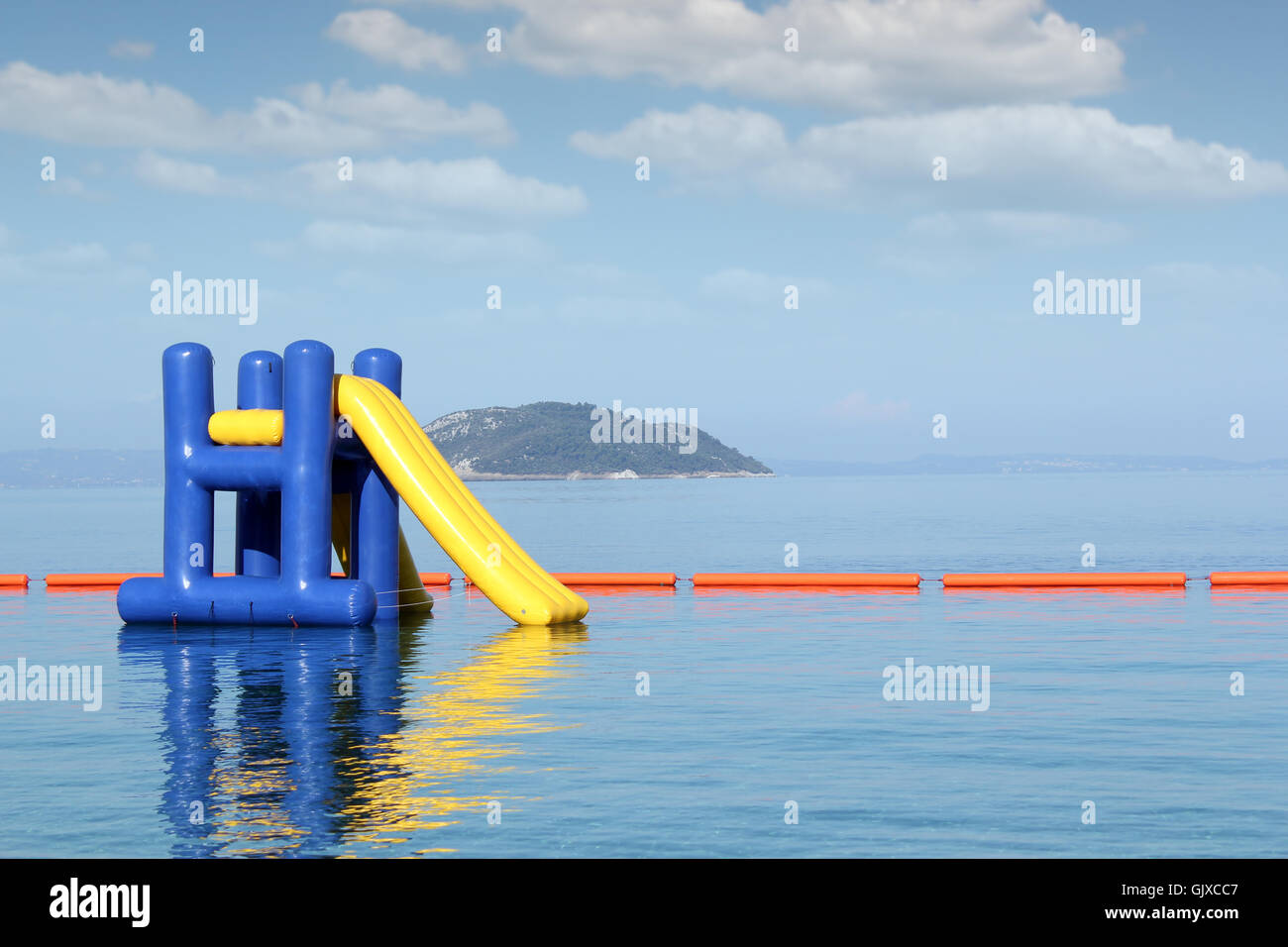 summer vacation scene with water slide Stock Photo - Alamy