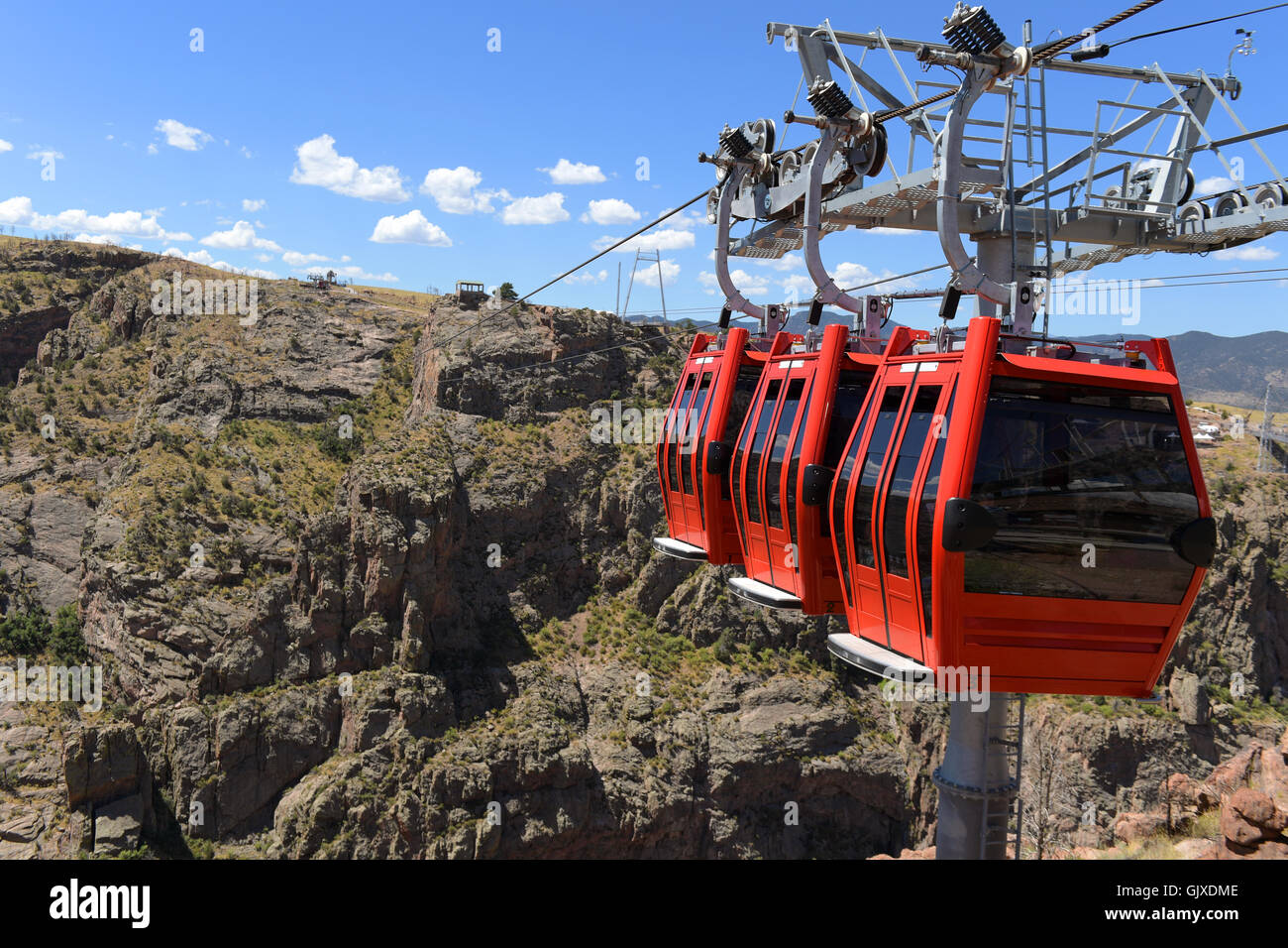 Red gondolas at the Royal Gorge in Colorado over the Arkansas river ...
