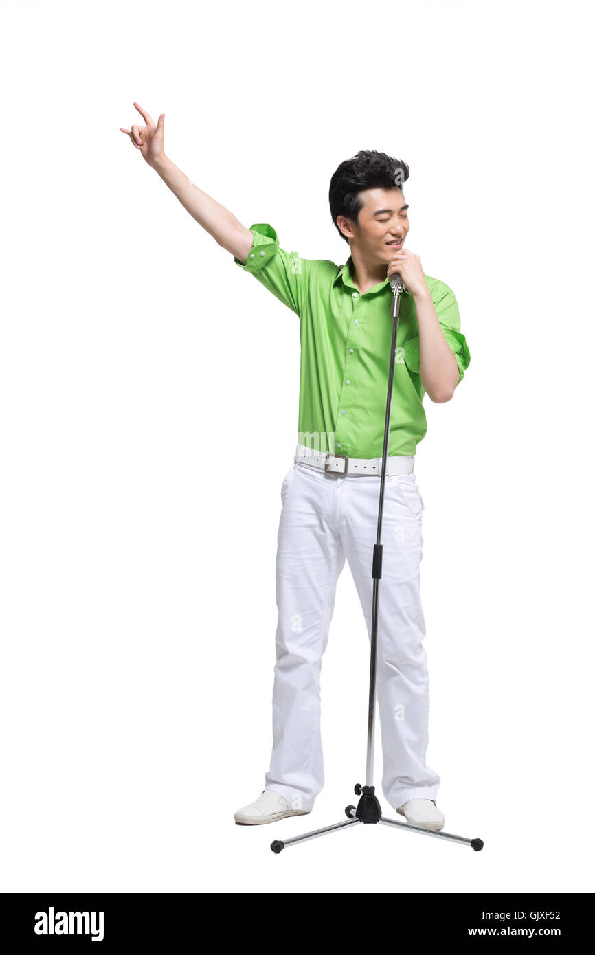 Fashion studio shot of young men singing and dancing Stock Photo - Alamy