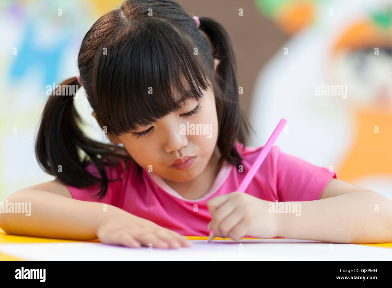 The little girl writing Stock Photo - Alamy