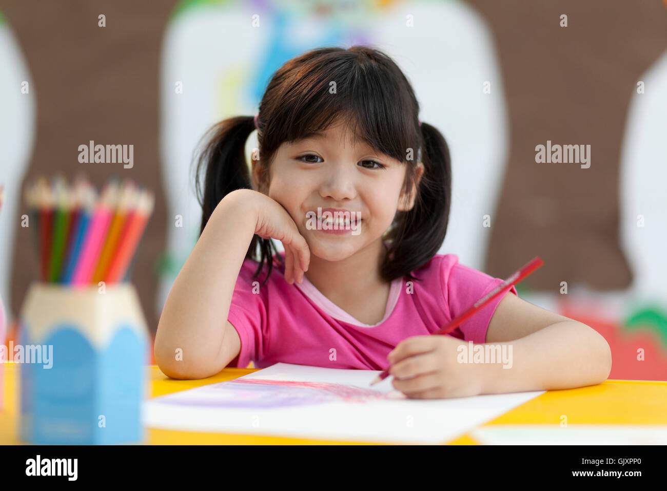 The little girl writing Stock Photo - Alamy