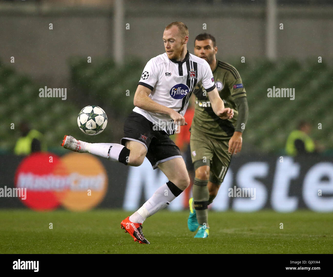 Dundalk's Chris Shields and Legia Warsaw's Nemanja Nikolic battle for ...