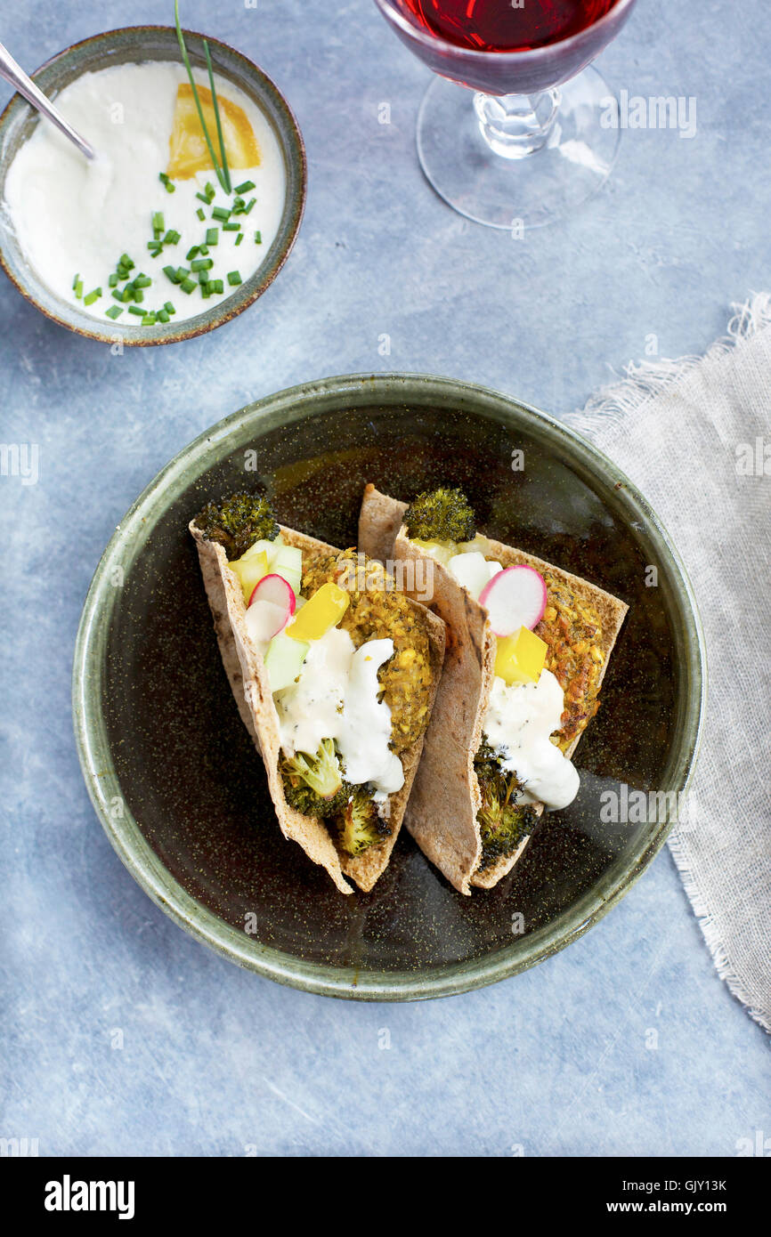 Charred broccoli falafel with charred broccoli, veggies in pita bread ...
