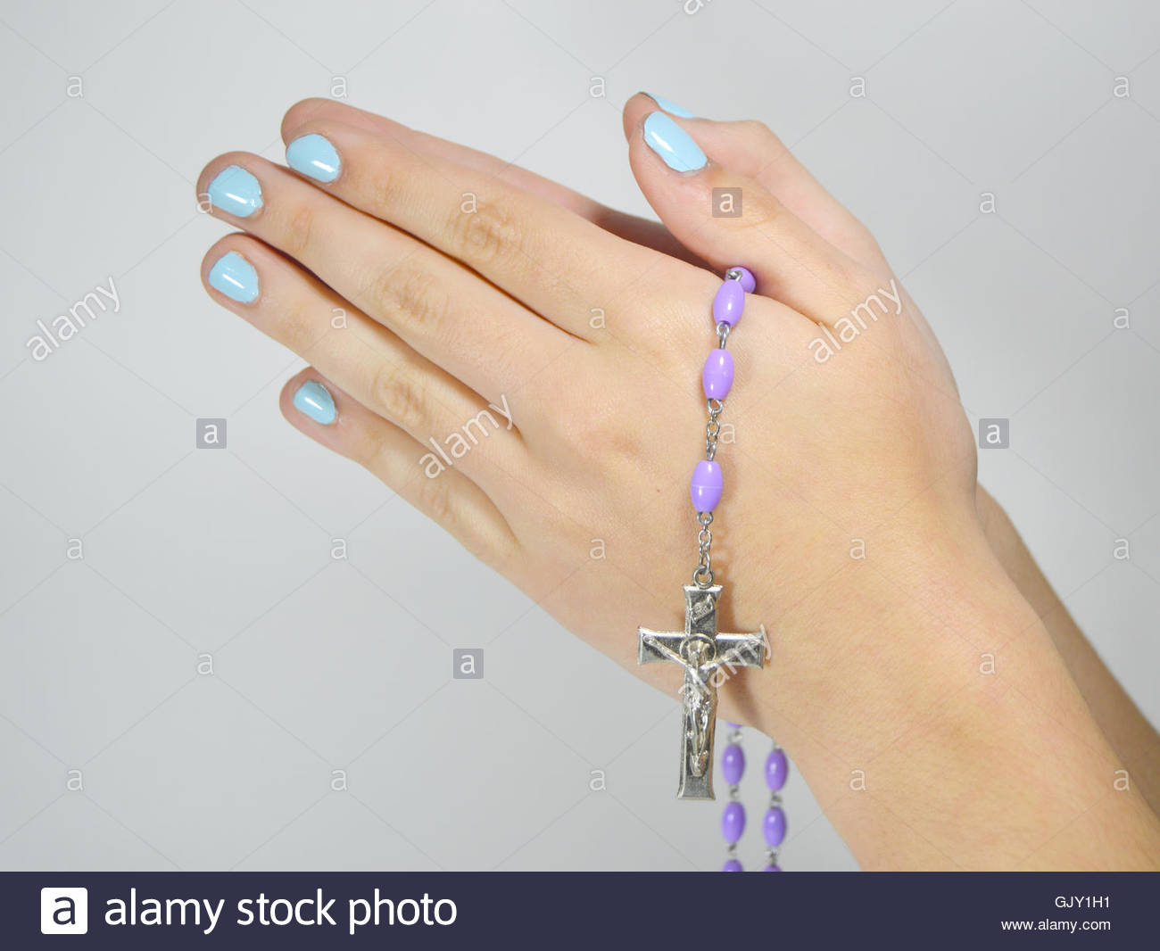 Praying Hands Holding Rosary Beads Stock Photos & Praying Hands Holding ...