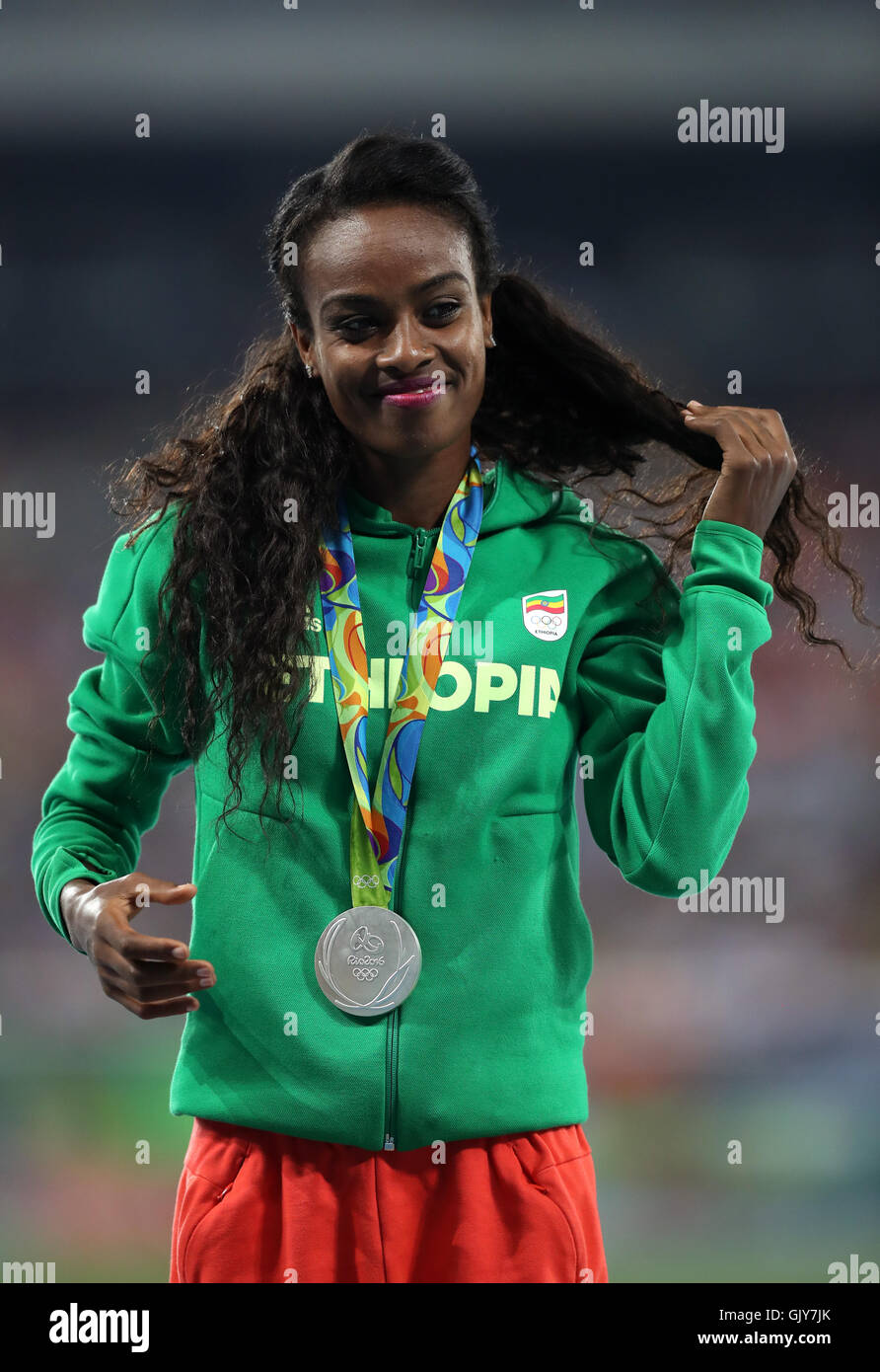 Ethiopia's Genzebe Dibaba on the podium with her silver medal for the ...