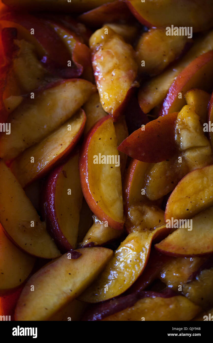 Sliced fresh peaches mixed with vanilla, cinnamon and sugar Stock Photo ...
