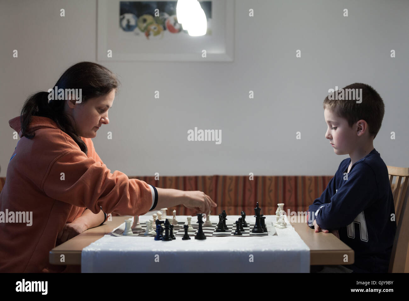 Child boy playing chess hi-res stock photography and images - Alamy