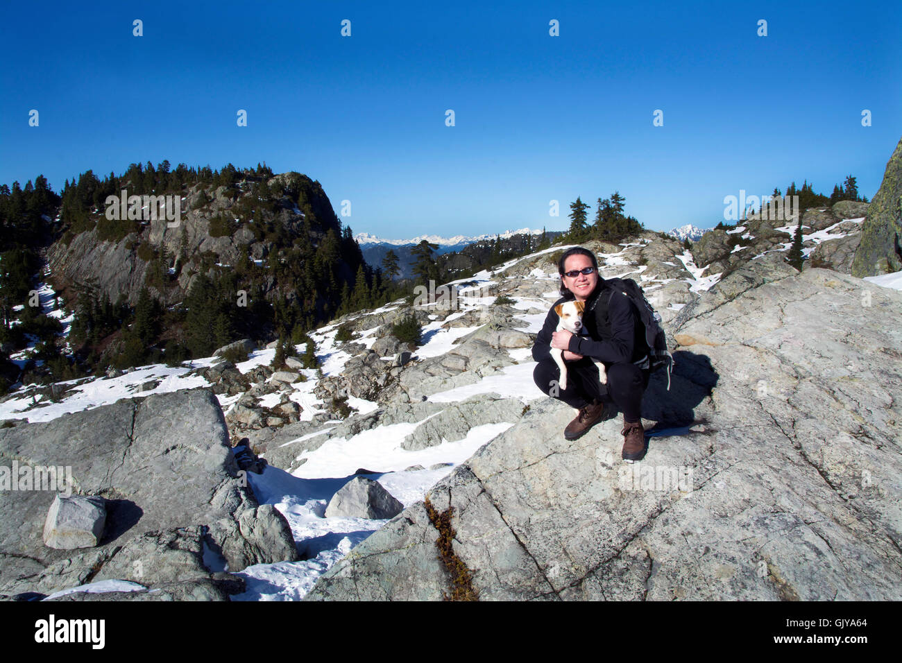 Chinese Canadian Man Hiking with Jack Russell Dog on British Columbia's ...