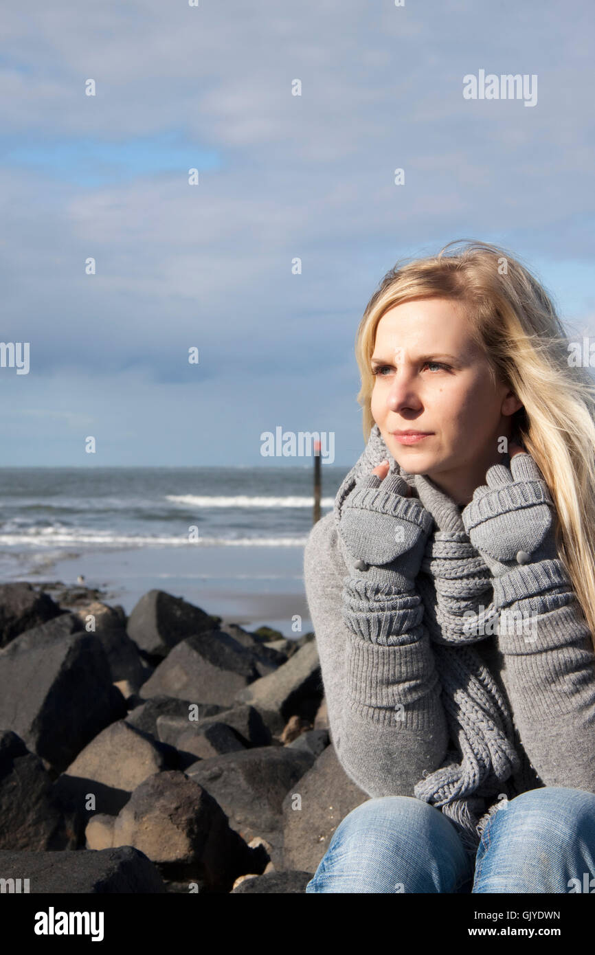 Teens sitting beach waves hi-res stock photography and images - Alamy