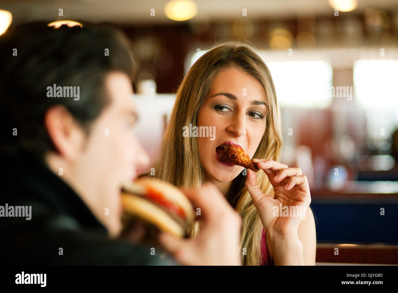 Restaurant eating junkfood table hi-res stock photography and images ...