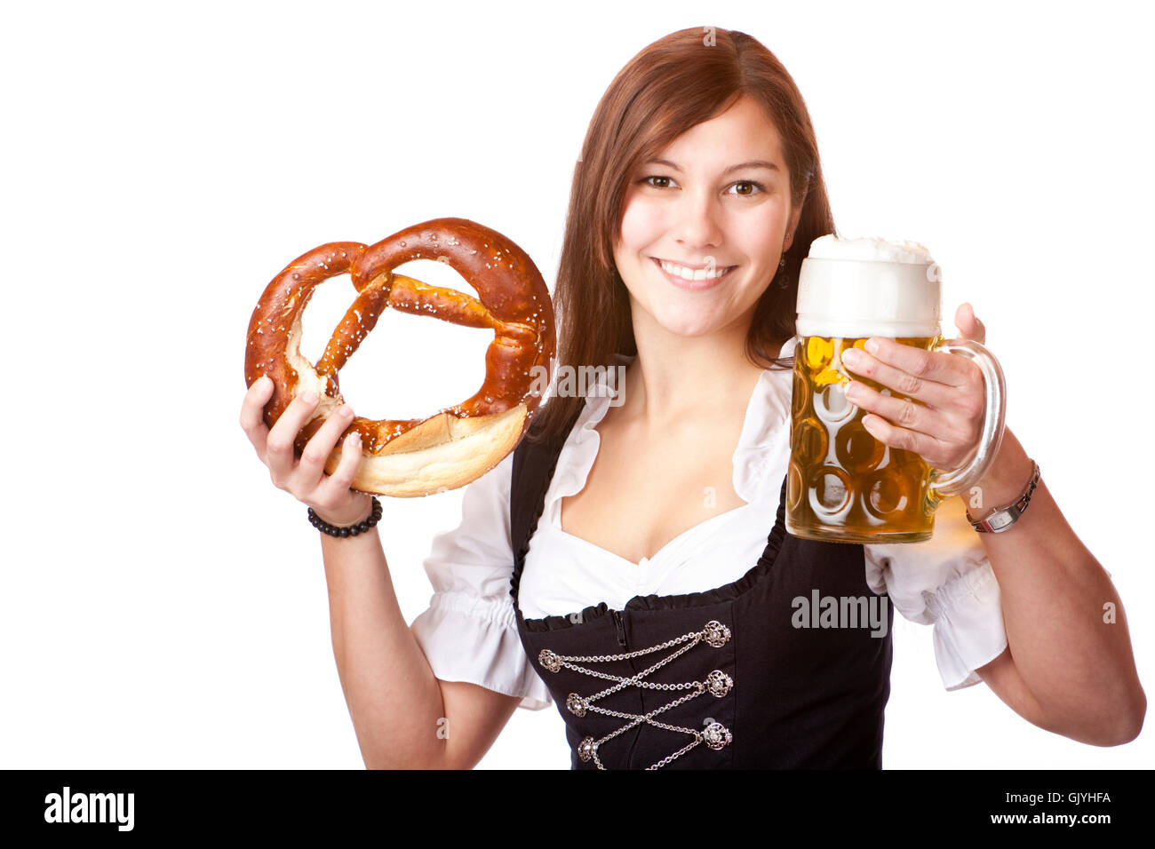 woman in dirndl holds oktoberfest beer stein and pretzel Stock Photo ...