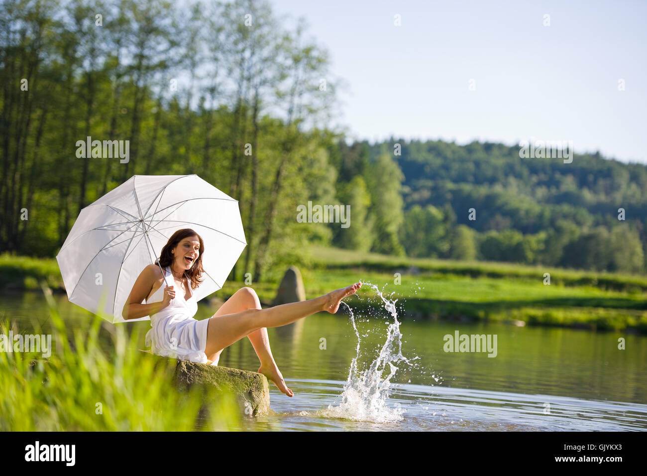 Water splash woman smile hi-res stock photography and images - Alamy