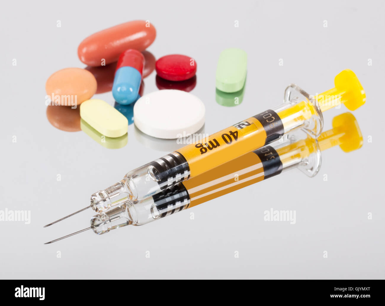 syringe with tablets Stock Photo - Alamy