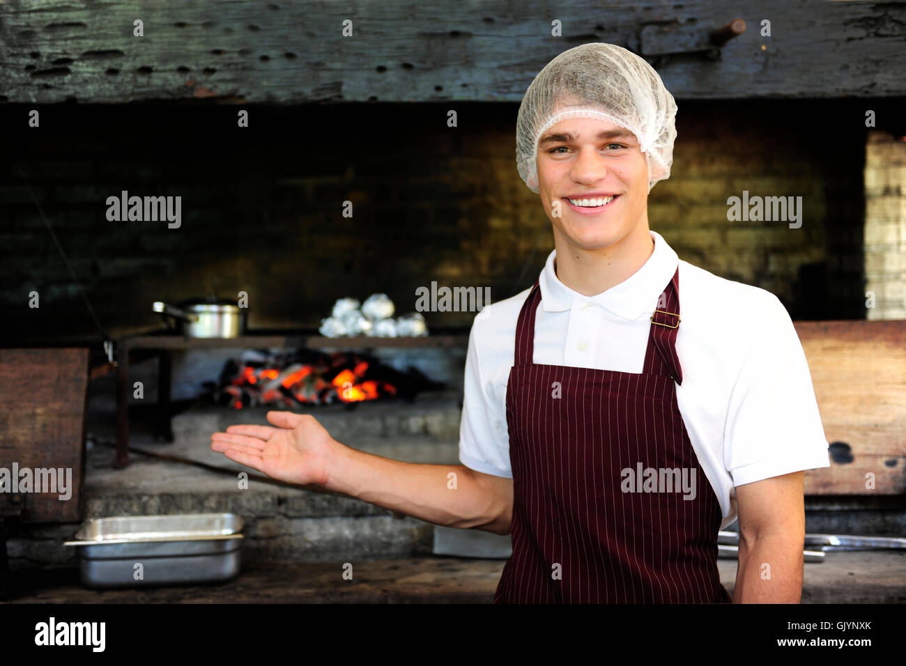 man working at a restaurant with wood-burning oven Stock Photo - Alamy