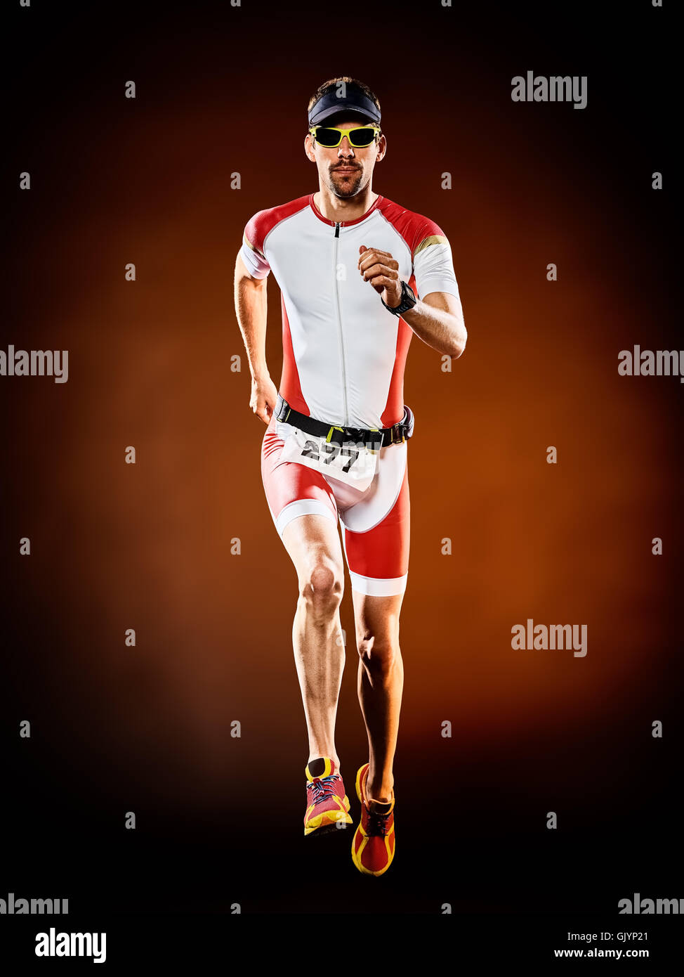 one caucasian man runner running triathlon ironman isolated Stock Photo ...