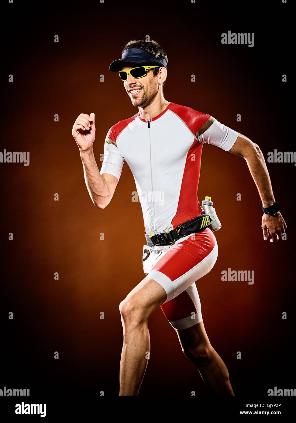 one caucasian man runner running triathlon ironman isolated Stock Photo ...