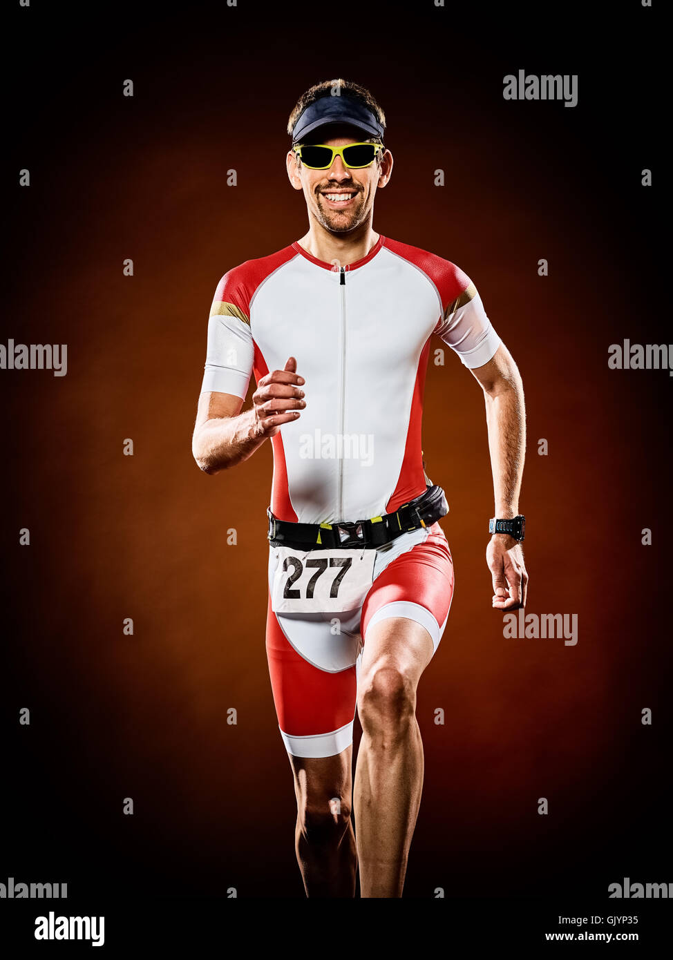 one caucasian man runner running triathlon ironman isolated Stock Photo ...