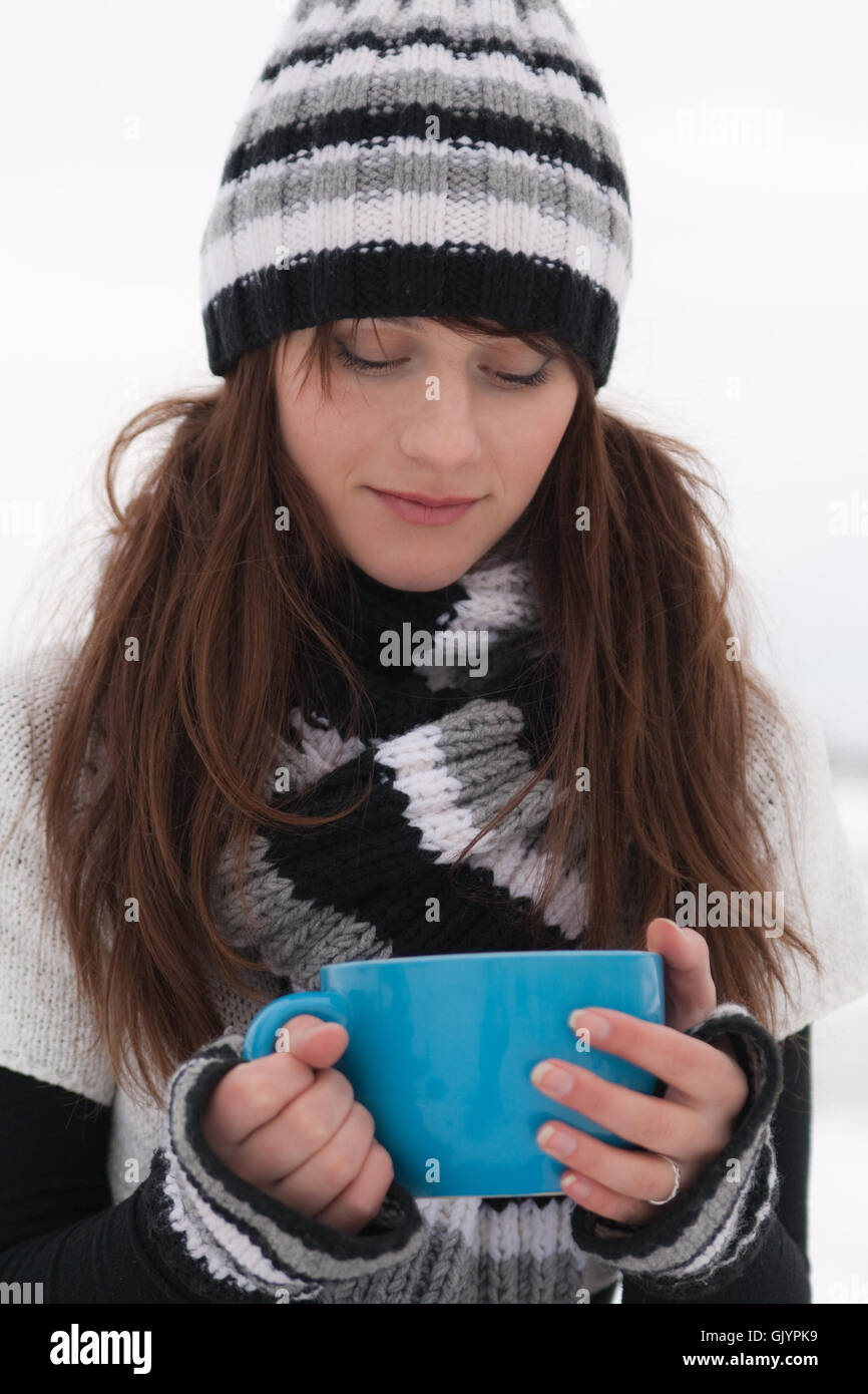 Sad girl holding a cup Stock Photo - Alamy