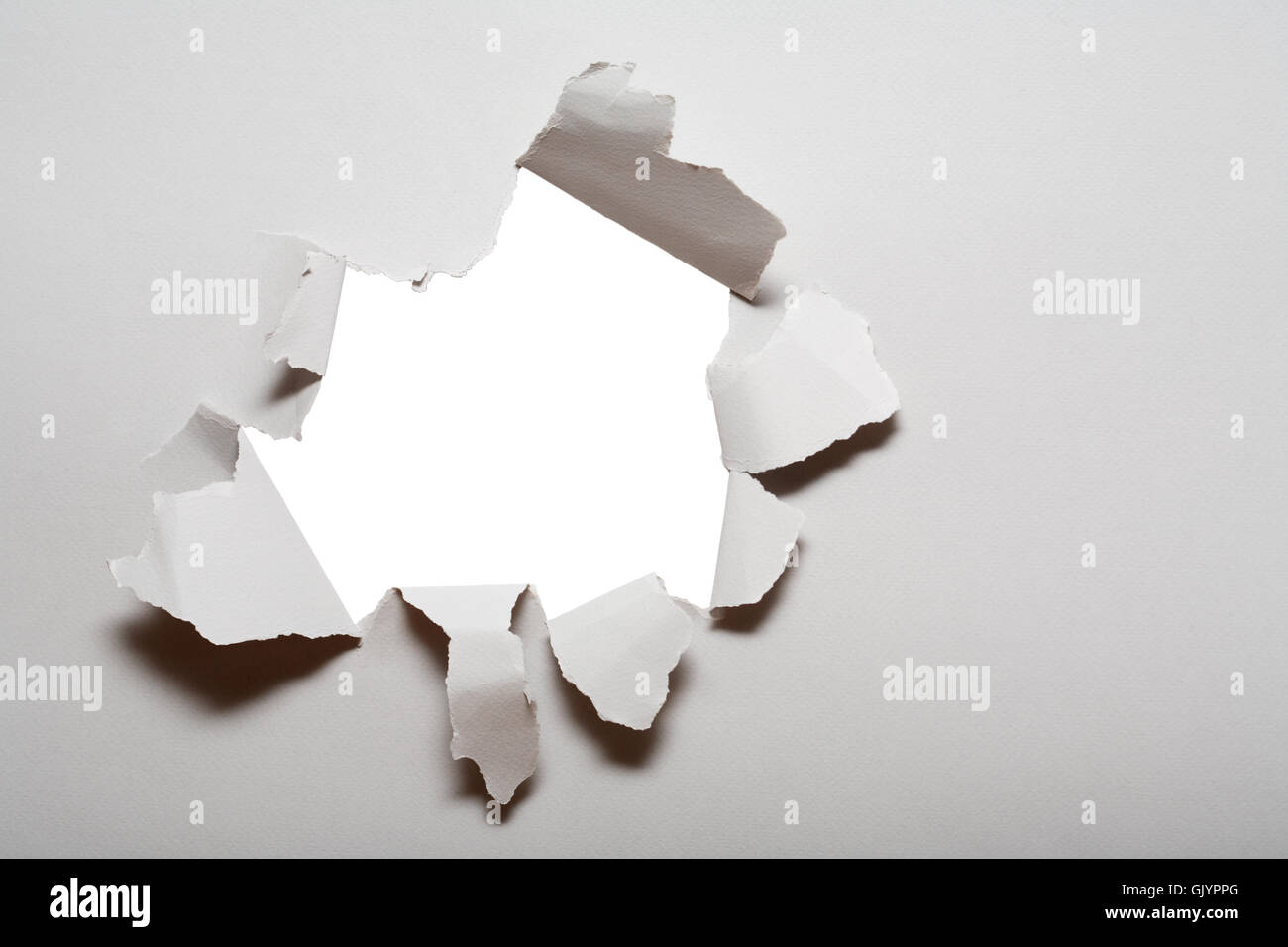 Hole In Paper Stock Photo - Alamy