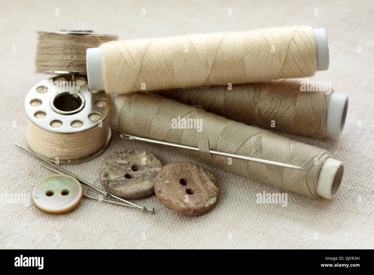 Button and needle hi-res stock photography and images - Alamy