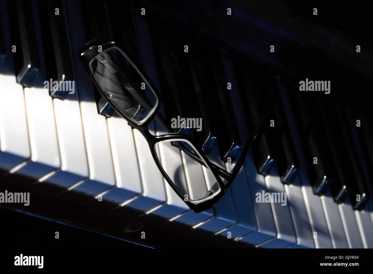 Eyeglasses On Piano Stock Photo - Alamy