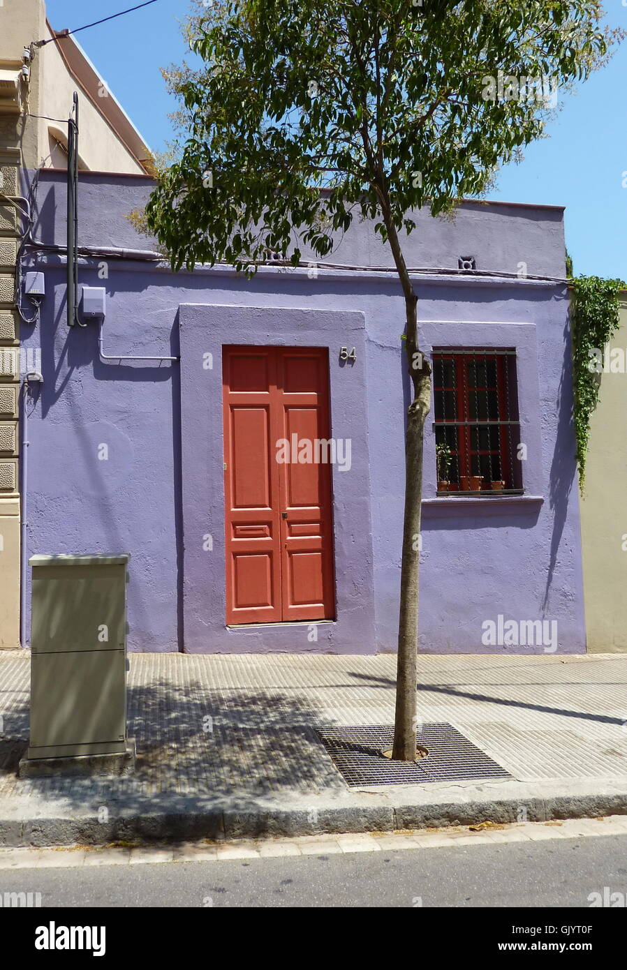 Red door and violet wall Stock Photo - Alamy