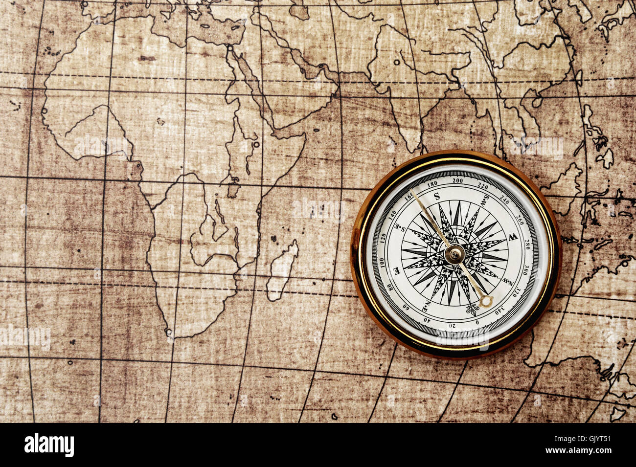 Compass on old map Stock Photo - Alamy