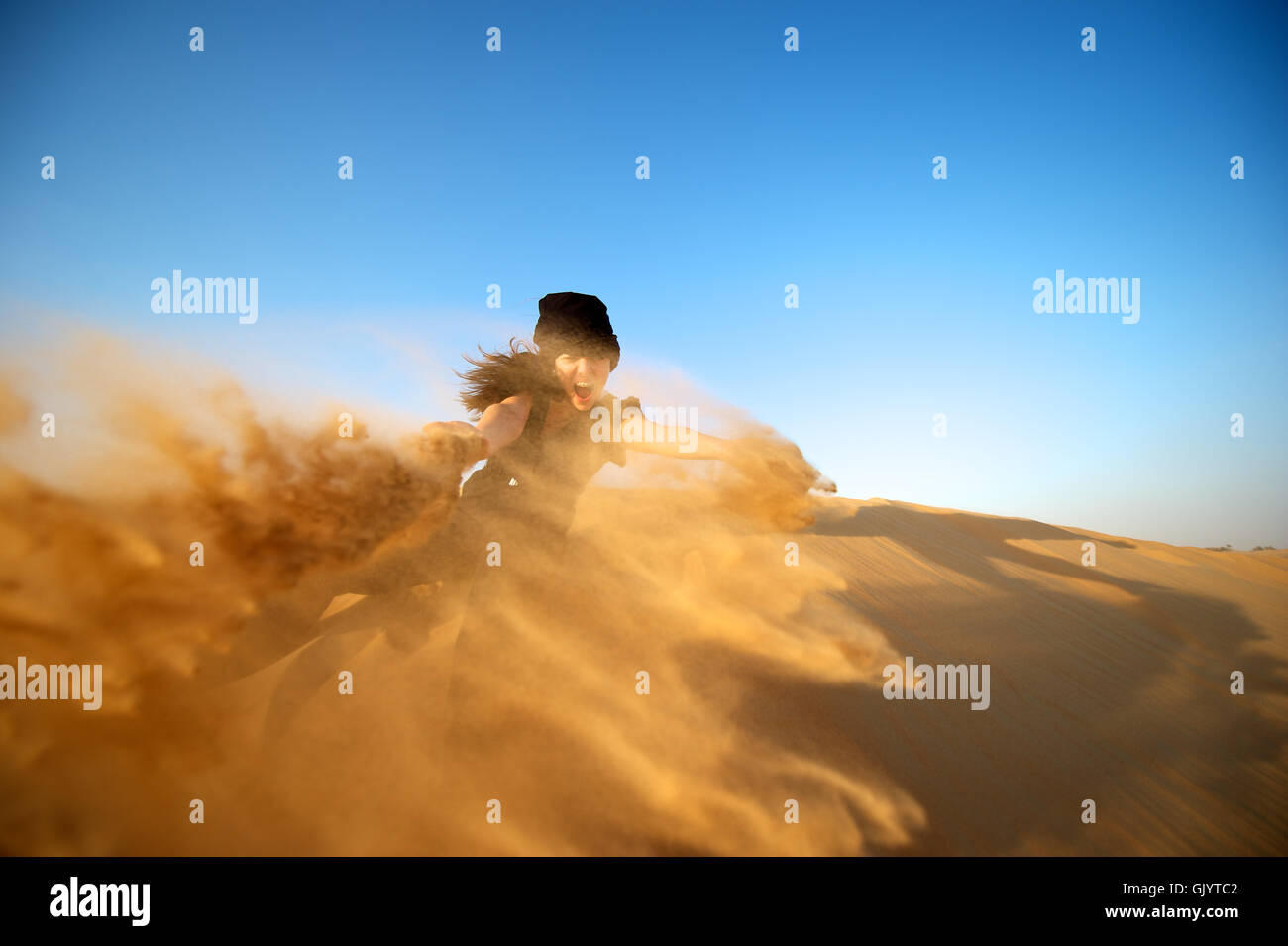 Woman in the desert Stock Photo - Alamy