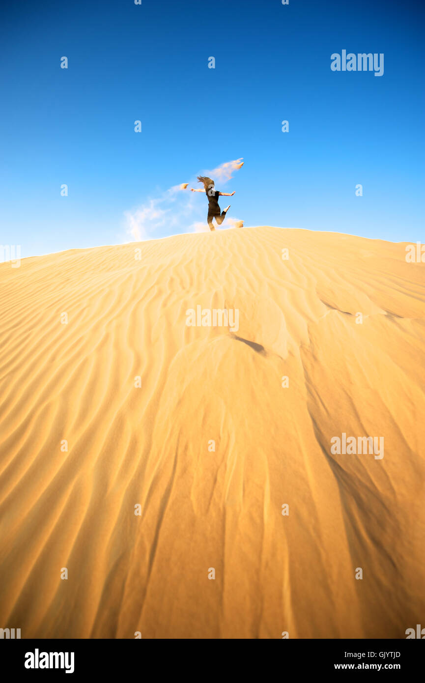 Woman in the desert Stock Photo - Alamy