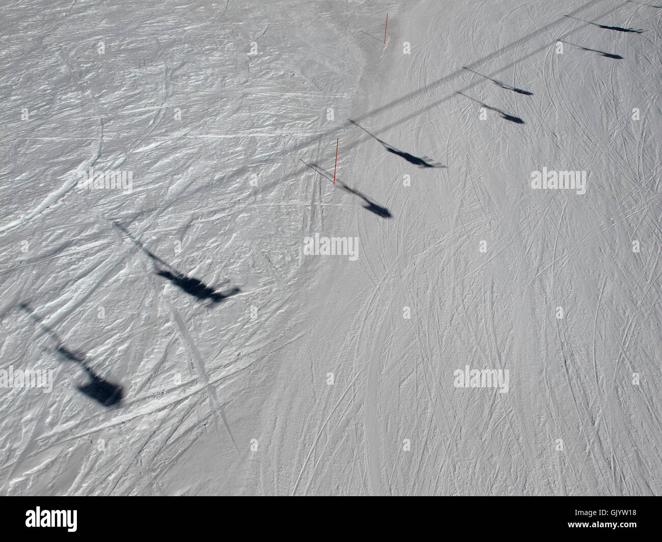 Shadow of a ski lift on snow Stock Photo - Alamy