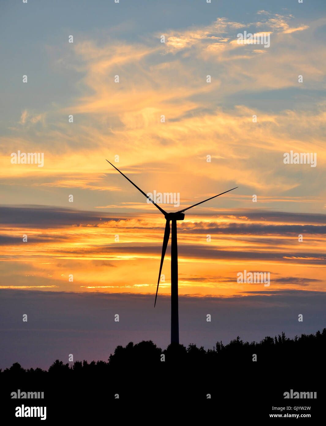 Wind turbine farm over sunset Stock Photo - Alamy