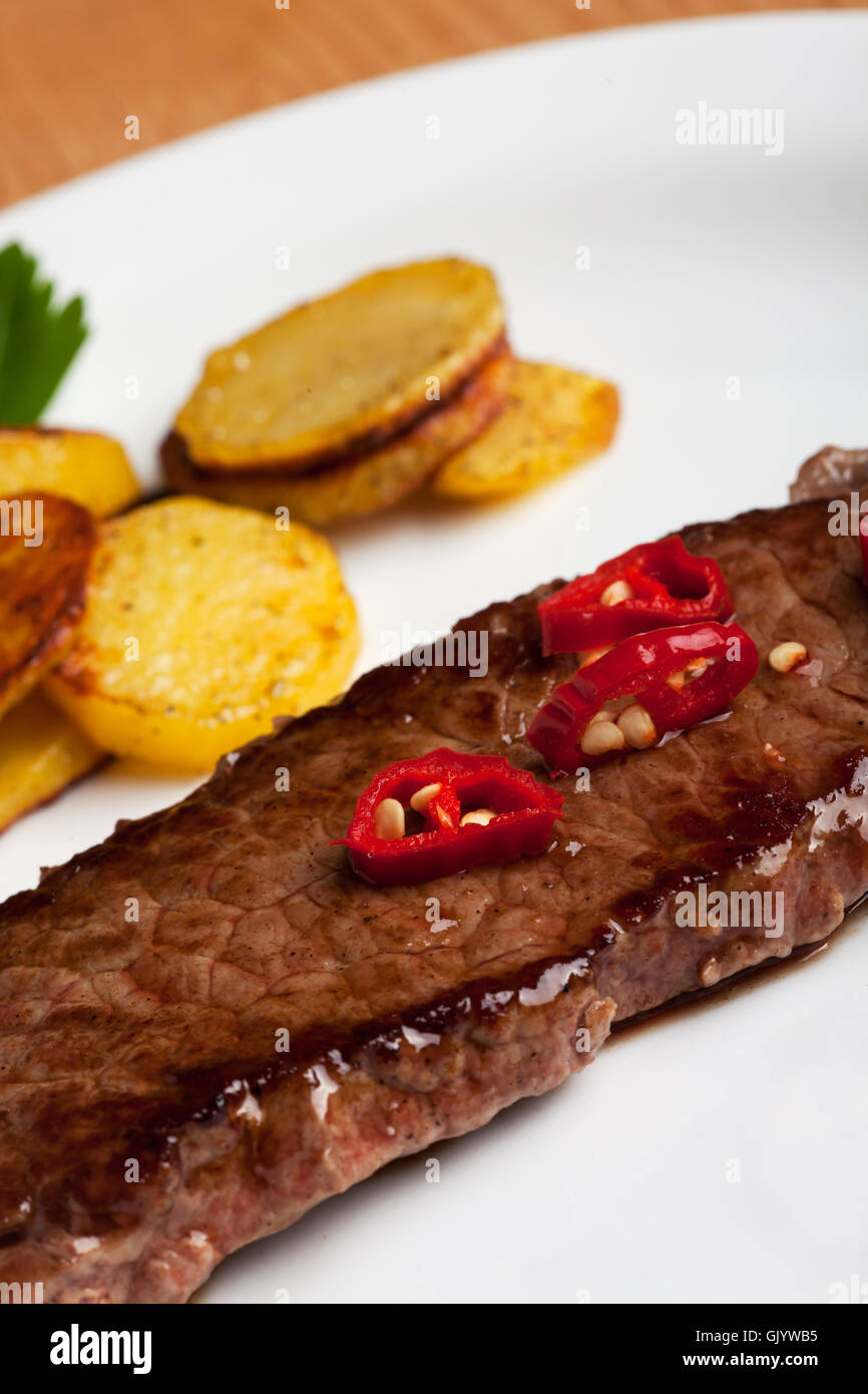 slices o chili on a steak Stock Photo - Alamy