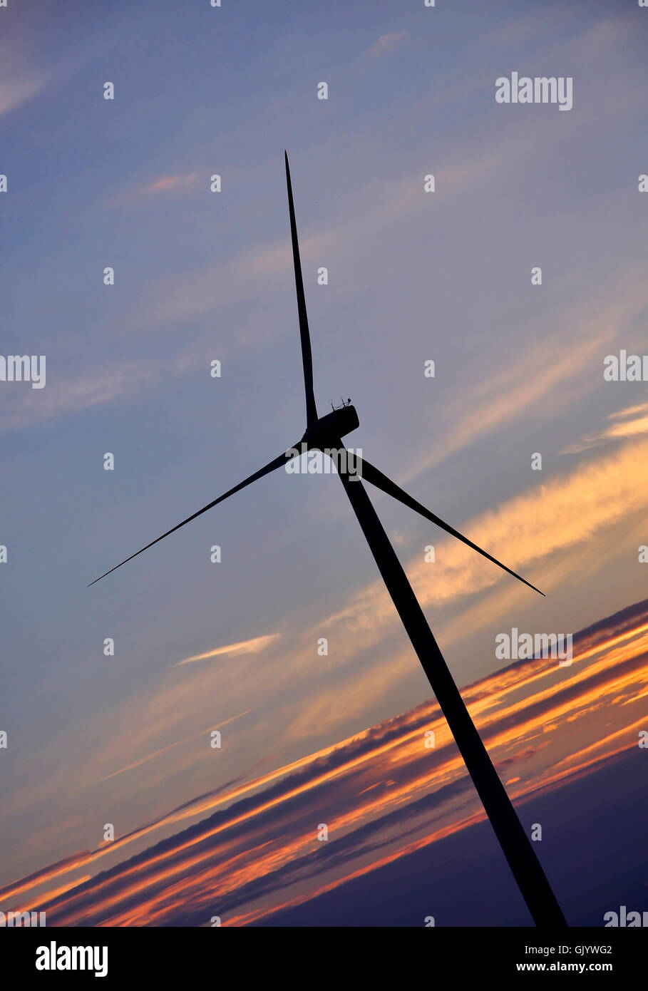 Wind turbine farm over sunset Stock Photo - Alamy