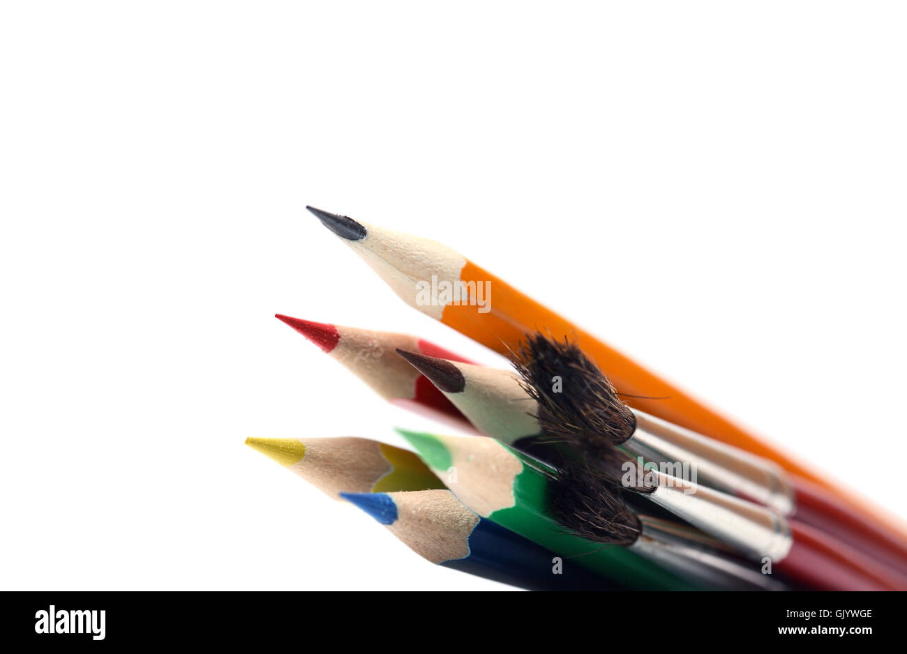 Paintbrushes and color pencils Stock Photo - Alamy